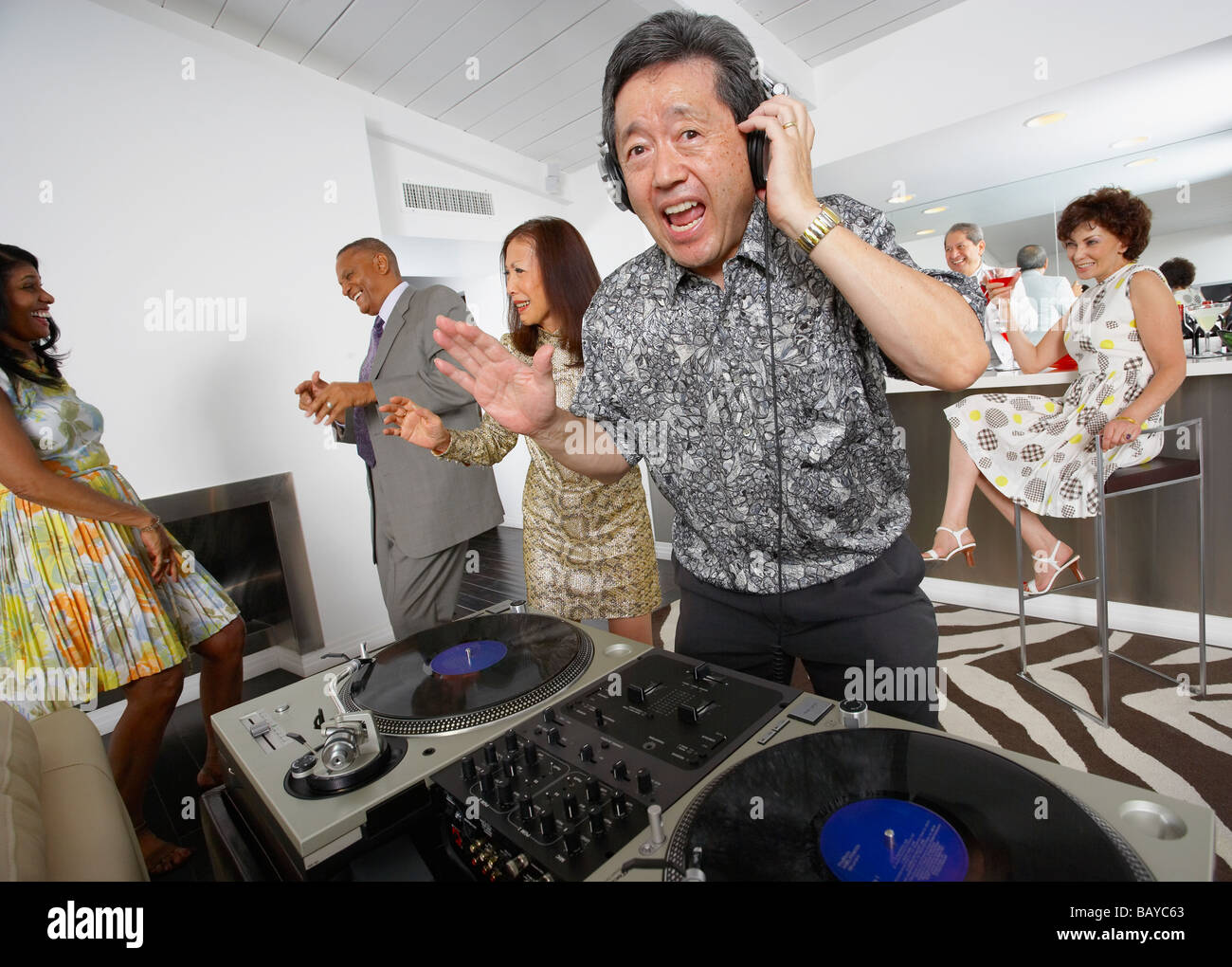 Asian DJ performing at party Stock Photo - Alamy