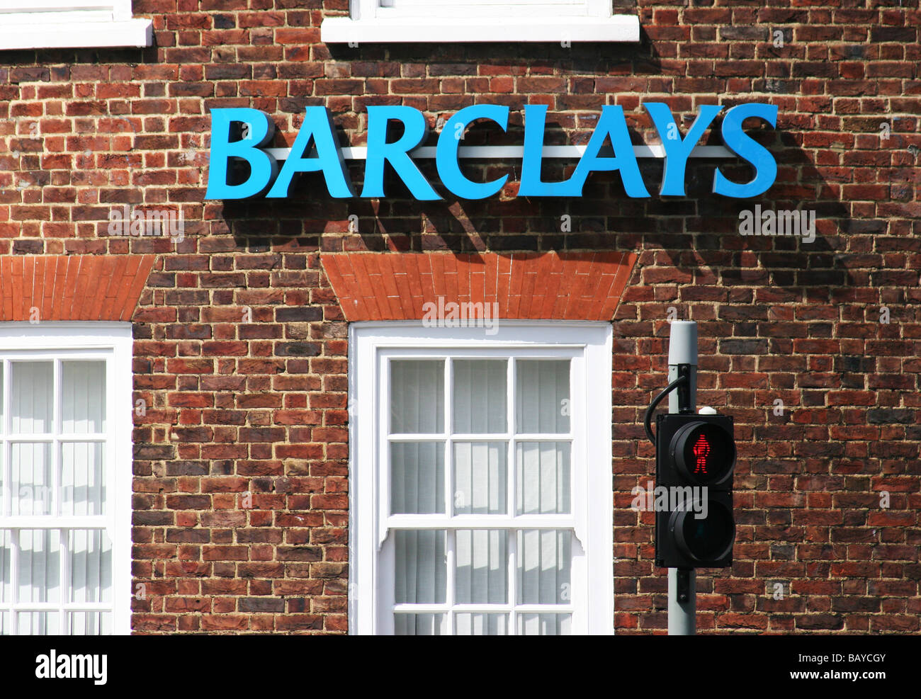 Blue Barclays bank text sign signage with red do not cross pedestrian ...