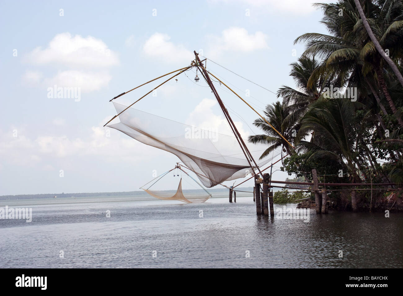 Chinese Fishing nets at harbor Stock Photo - Alamy