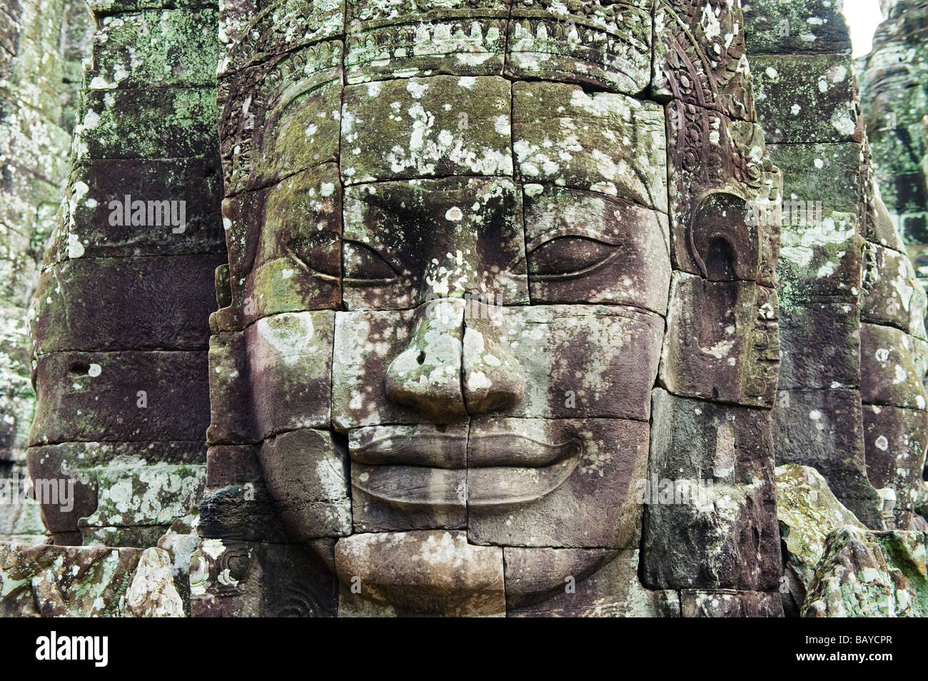 One of the many carved faces in Angkor Thom or the Bayon Temple ...