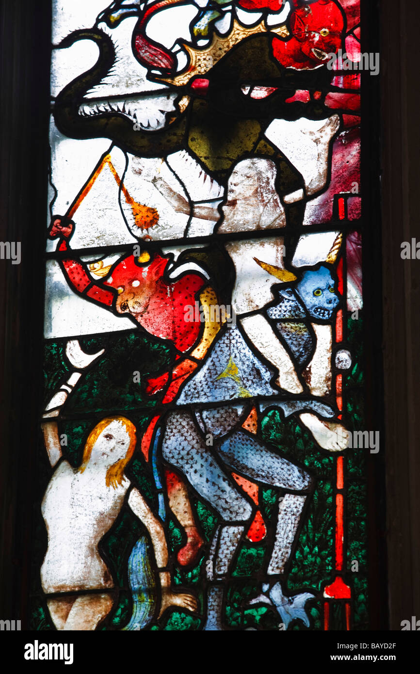 Stained glass medieval church devil hi-res stock photography and images ...