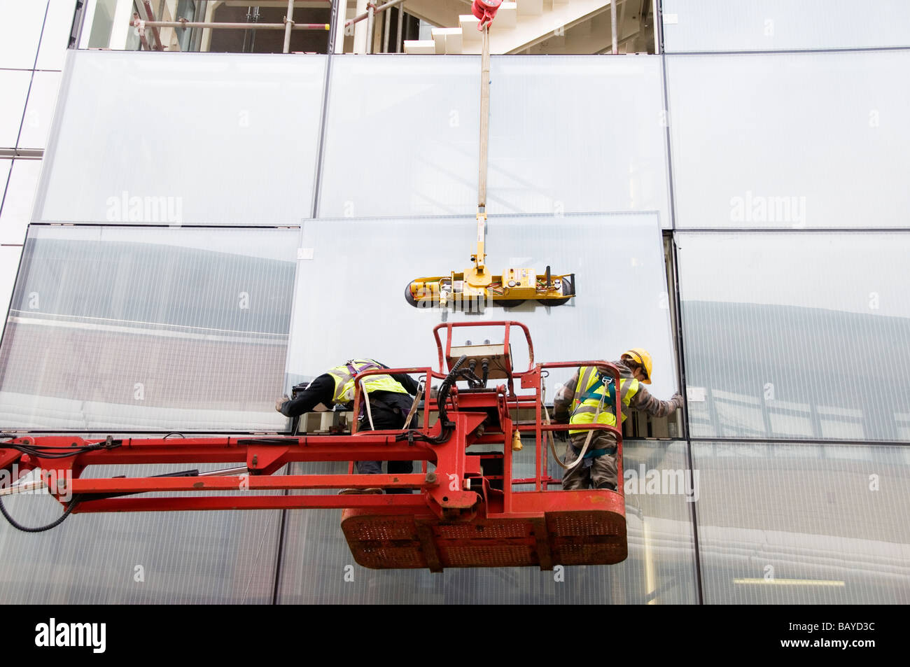 Construction workers installing new windows window hi-res stock ...