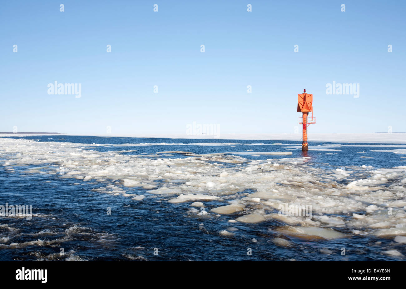 Breaking sea ice on ship's wake and orange seamark / beacon , Bothian ...