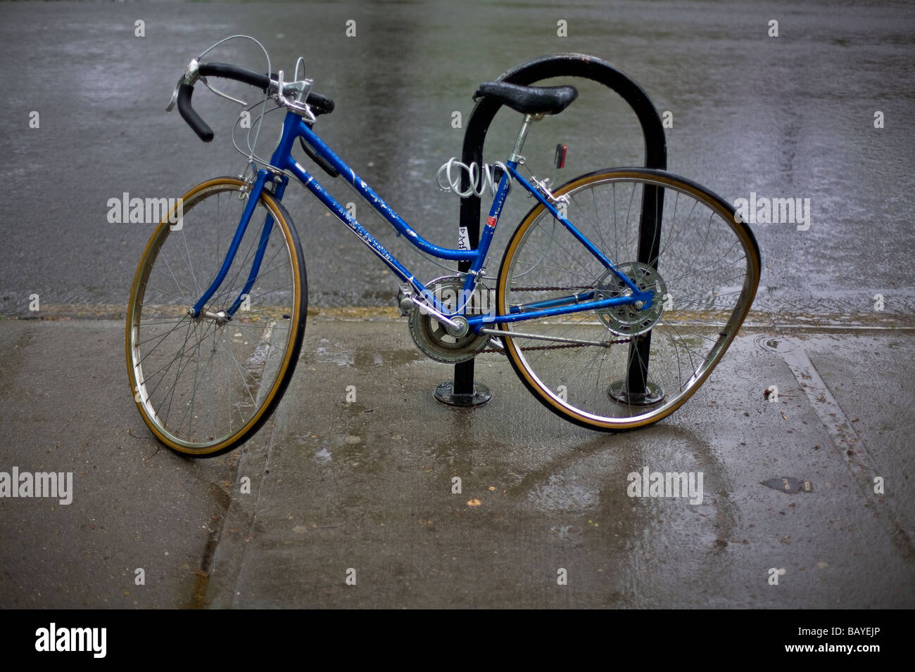 Bicycle with tilted wheel chained to a poll Stock Photo - Alamy Bicycle with tilted wheel chained to a poll Stock Photo - Alamy