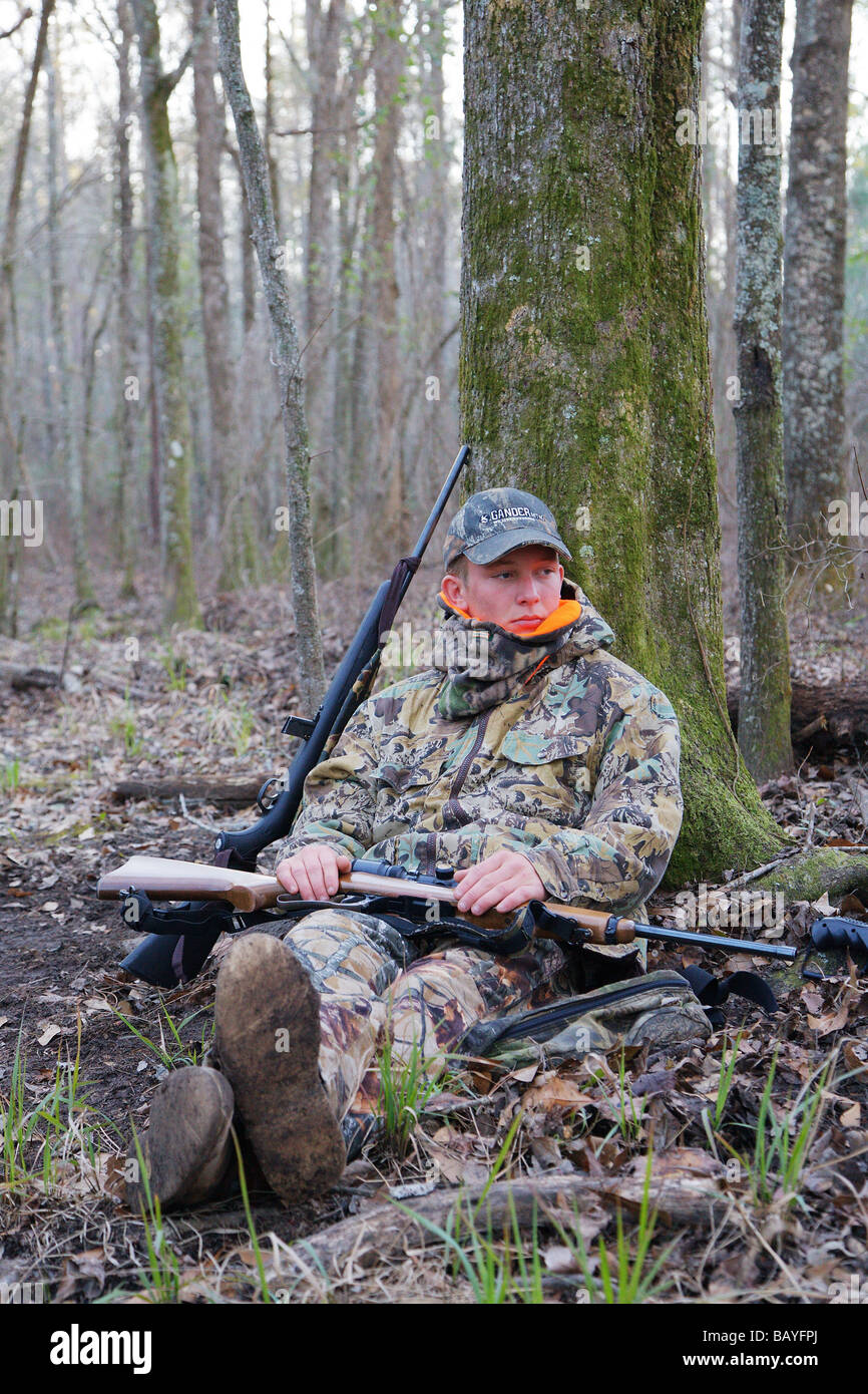 Hunter resting against tree looking hi-res stock photography and images ...