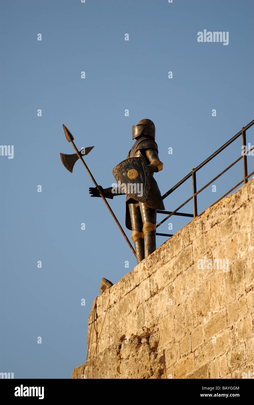 An empty suit of armor stands guard on the clock tower of the Palace of ...