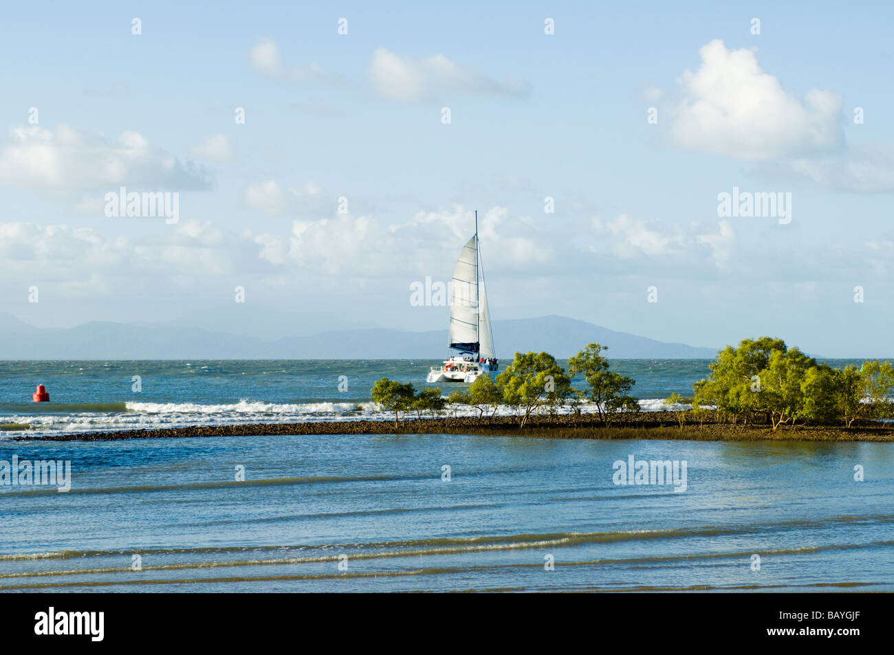 Sailing boat leaving Port Douglas harbour Stock Photo - Alamy