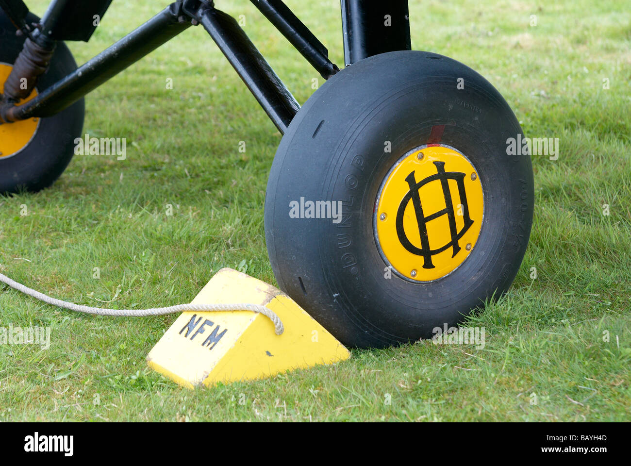 Wheel chocks and landing gear wheel - de Havilland DH 82 Tiger Moth, a ...