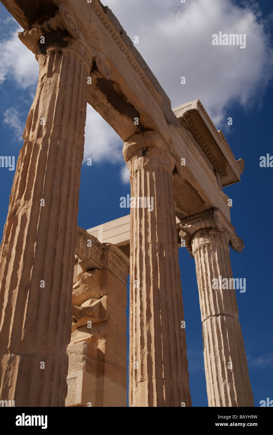 Ancient columns of the Parthenon stand against a blue sky Athens Greece ...