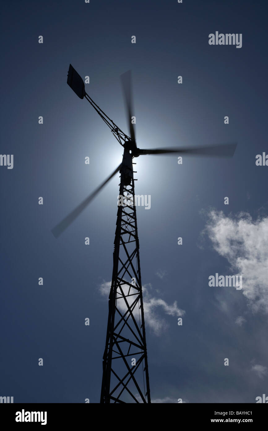sun shining down on a medium sized wind turbine in county tyrone ...