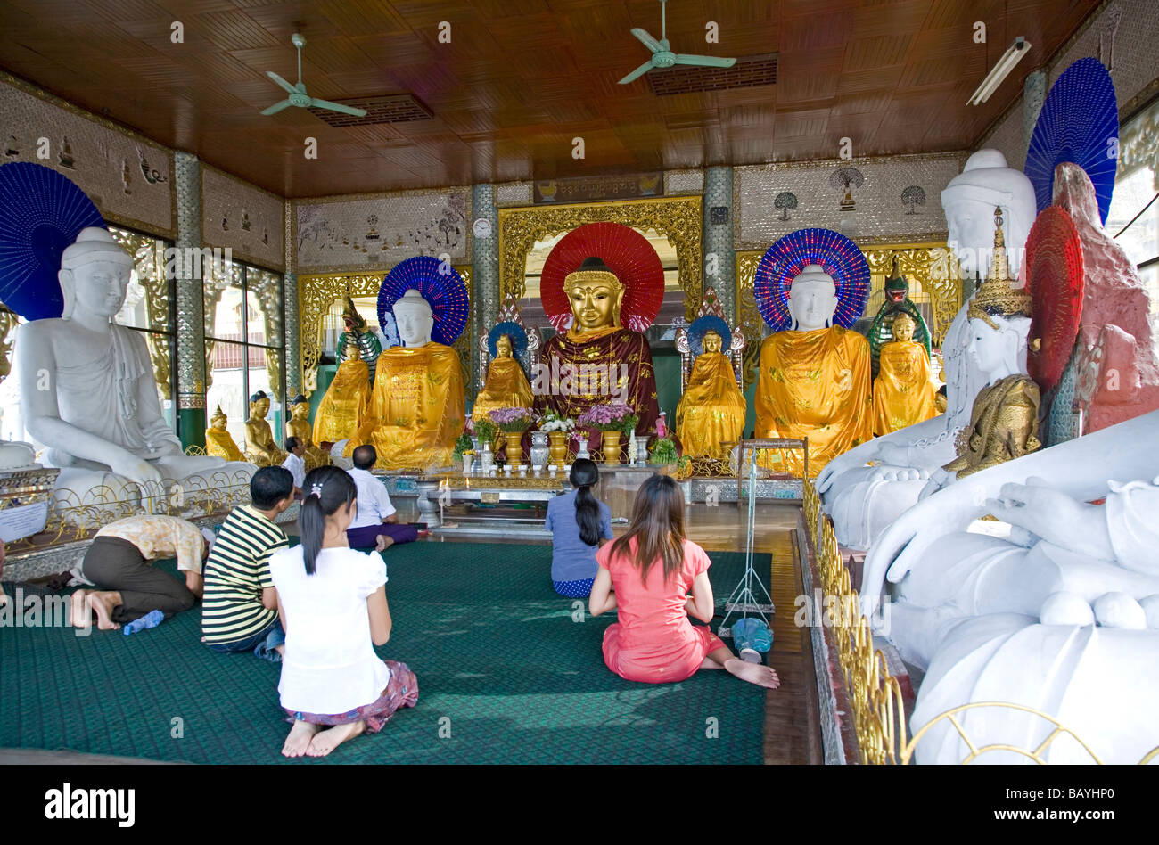 People praying at Buddhas pavilion. Shwedagon Paya. Yangon. Myanmar ...
