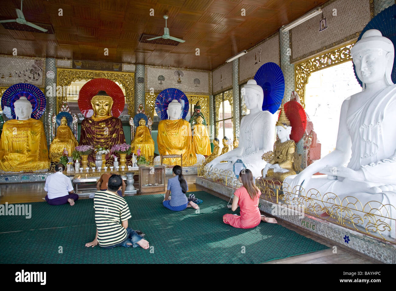 People praying at Buddhas pavilion. Shwedagon Paya. Yangon. Myanmar ...