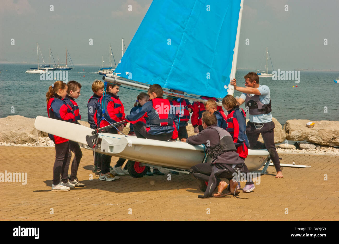 Young people sail training with a Laser Pico sailing dinghy at Weymouth ...