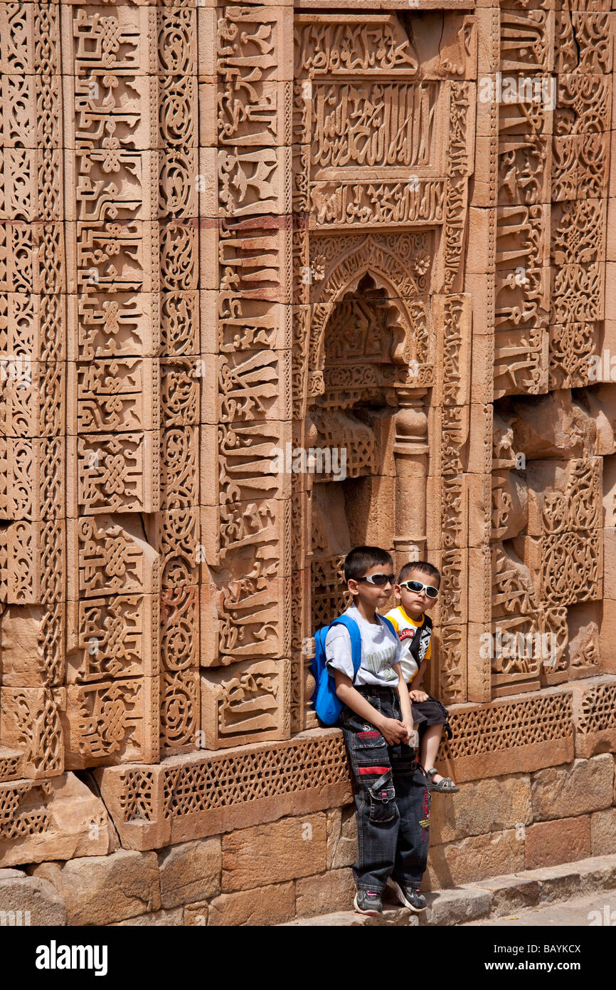 Indian Boys in a Mihrab at the Qutb Minar Complex in Delhi India Stock ...
