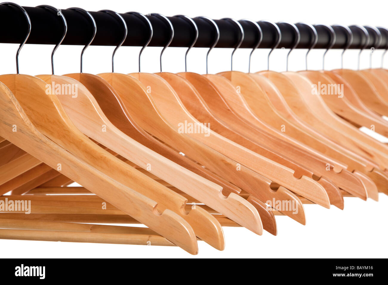 Row of clothes hangers on a rail Stock Photo - Alamy