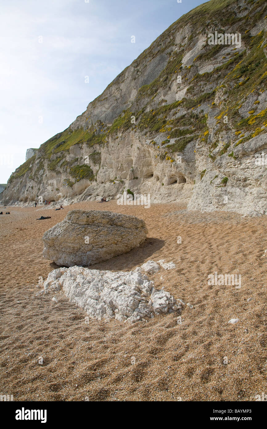 Caves along fault line of chalk cliffs beach Dorset England Stock Photo ...
