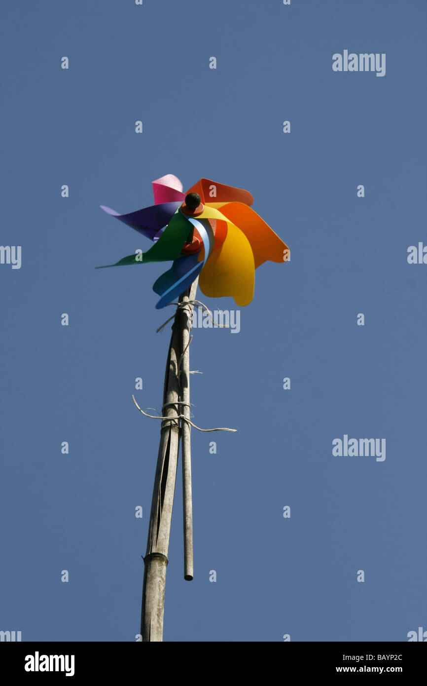 colourful windmill toy and blue sky outdoors in sun Stock Photo - Alamy