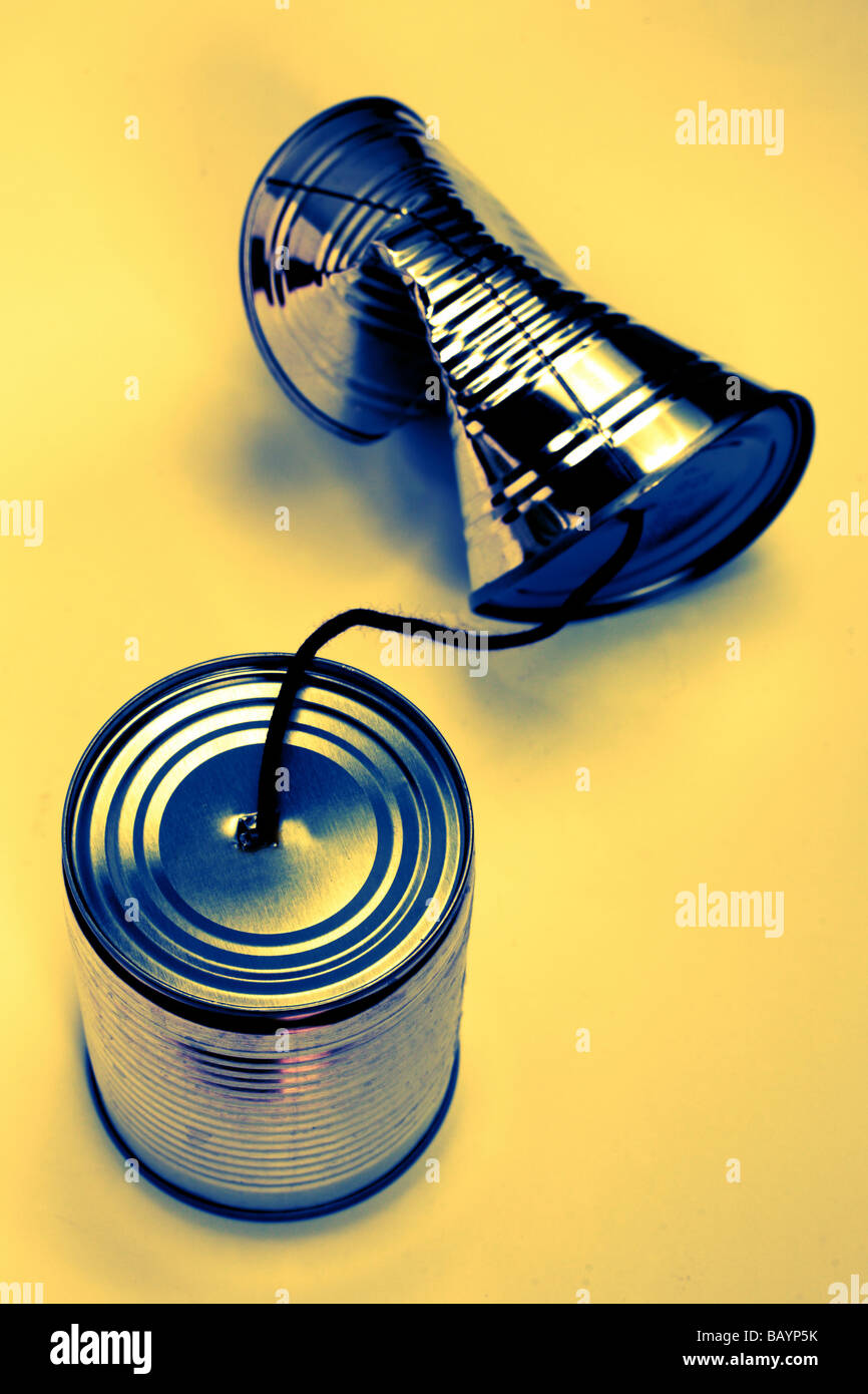Two tin cans linked broken communication concept Stock Photo - Alamy