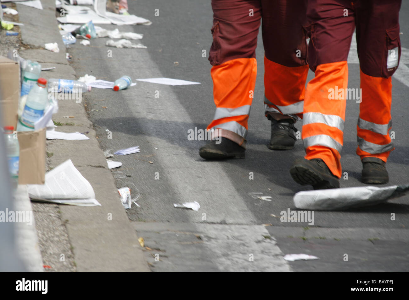 two street cleaners workers walking on dirty street Stock Photo - Alamy