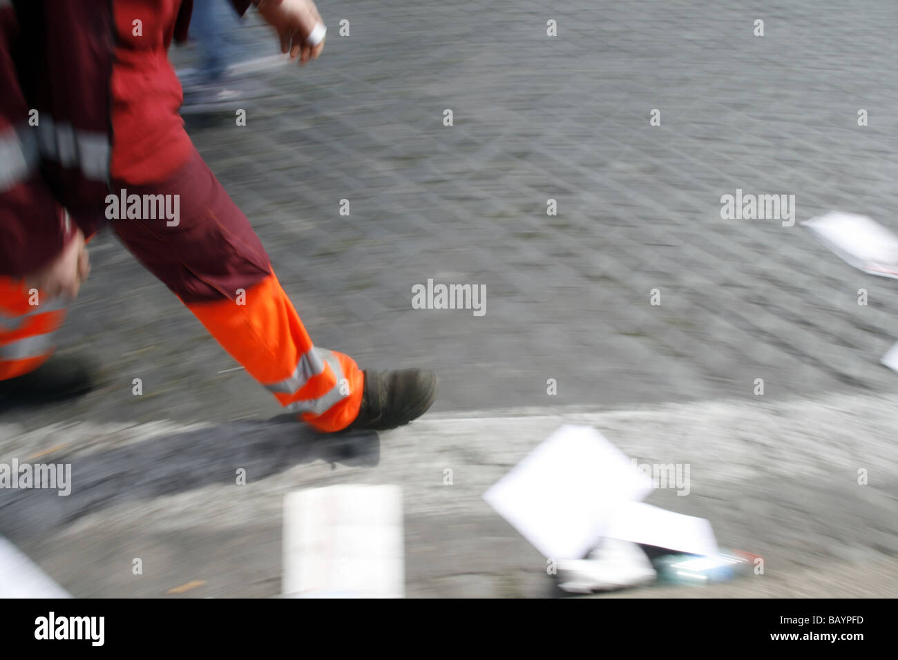 street cleaner worker walking on dirty street Stock Photo - Alamy