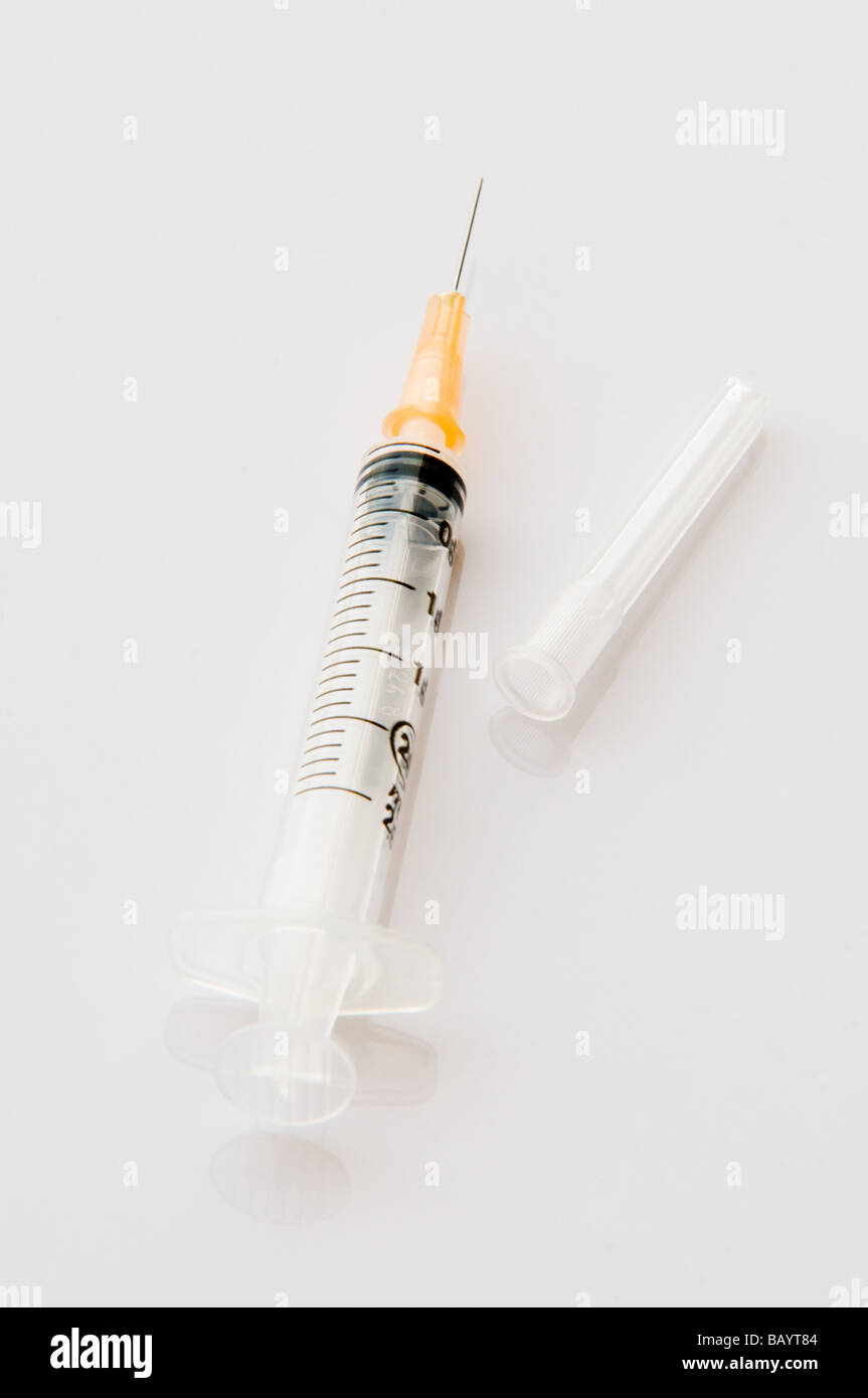 White syringe with white background Stock Photo - Alamy