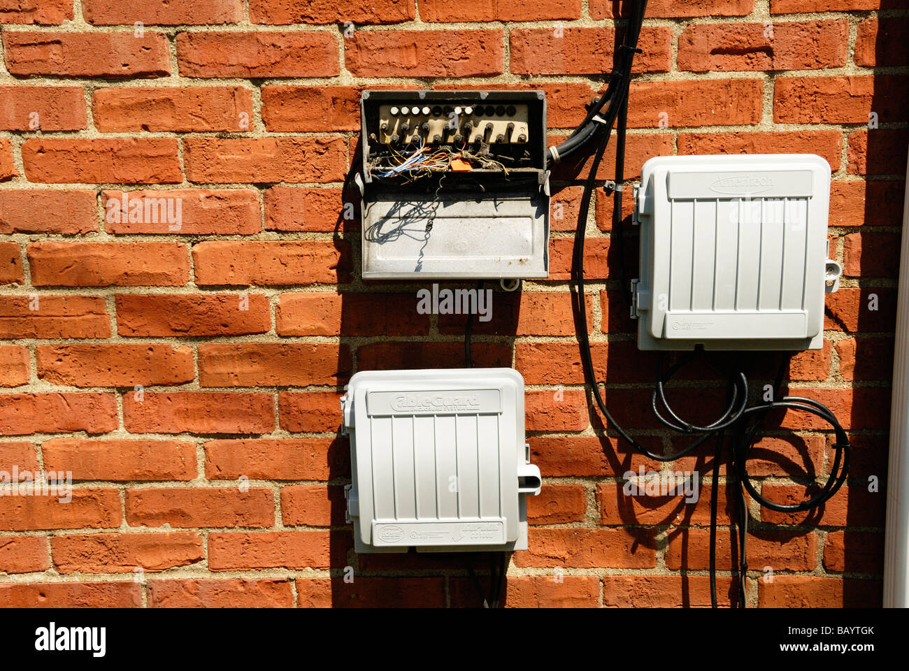 Telephone connection on side of apartment building Stock Photo - Alamy