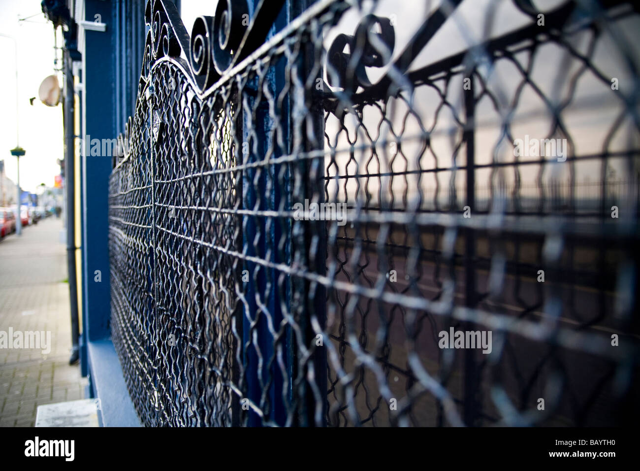 Iron grating across a window in Cobh Ireland Stock Photo - Alamy