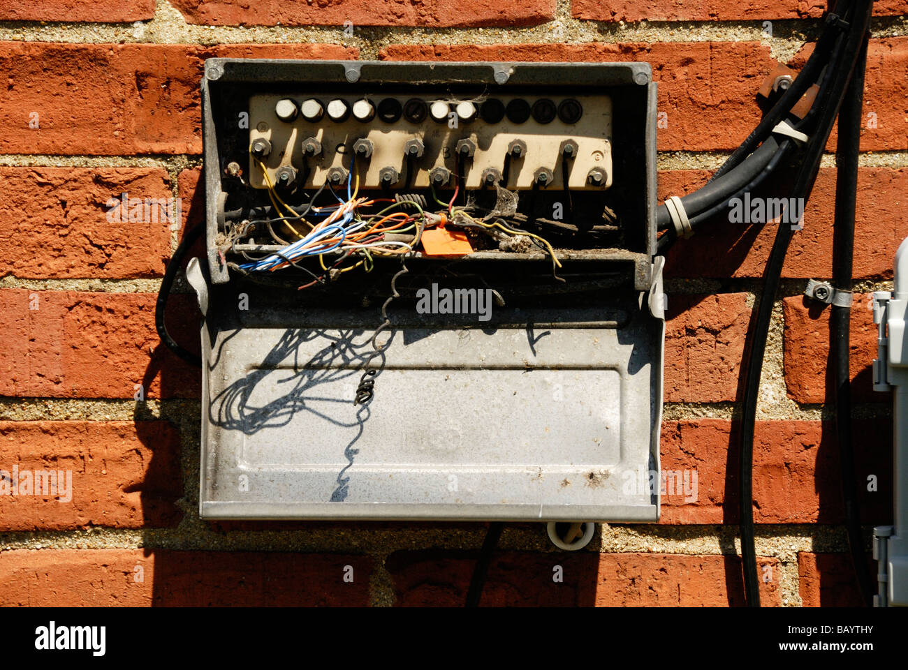 Telephone connection on side of apartment building Stock Photo - Alamy