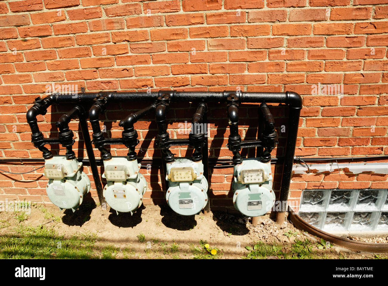 Gas meter on side of building Stock Photo - Alamy