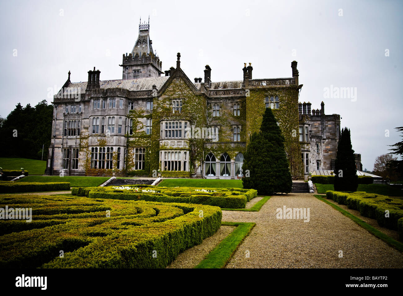 Facade of the Adare Manor house in County limerick showing landscaped ...