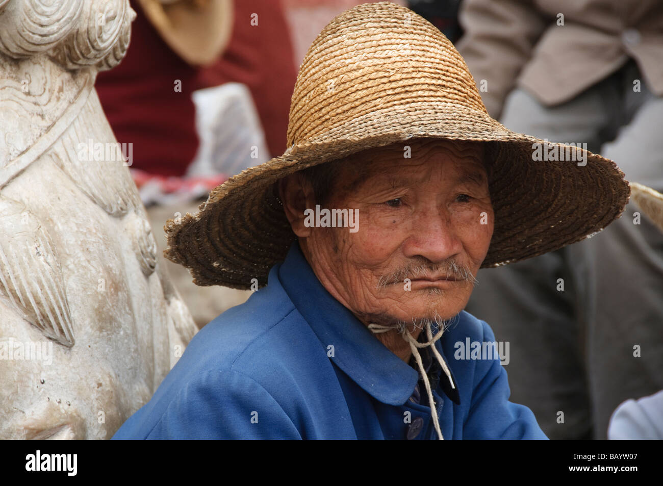 old man watching the world go by in Jianshui China Stock Photo - Alamy