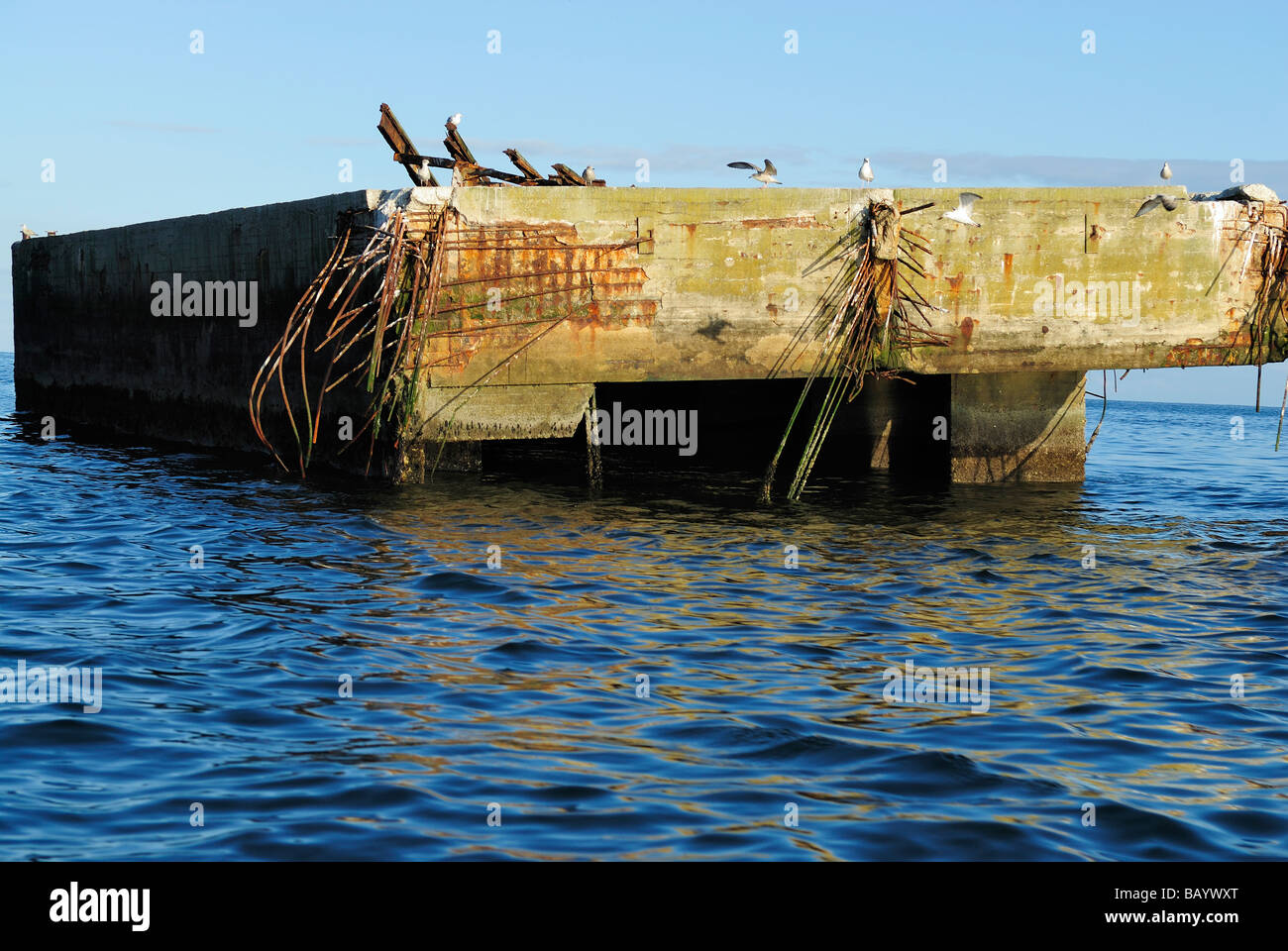 Remains of the artificial harbour Mulberry B in Arromanches Stock Photo ...