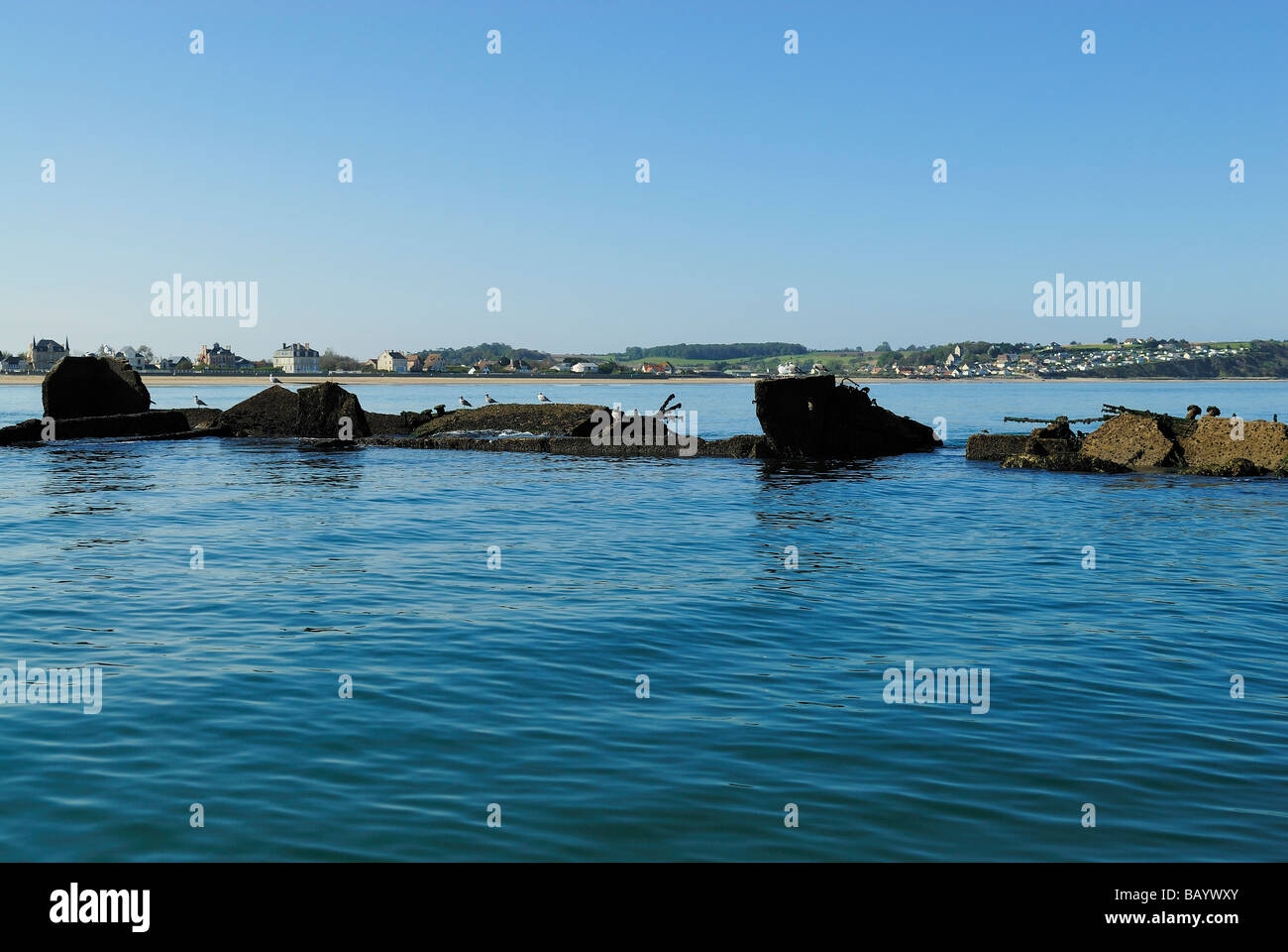 Remains of the artificial harbour Mulberry B in Arromanches Stock Photo ...