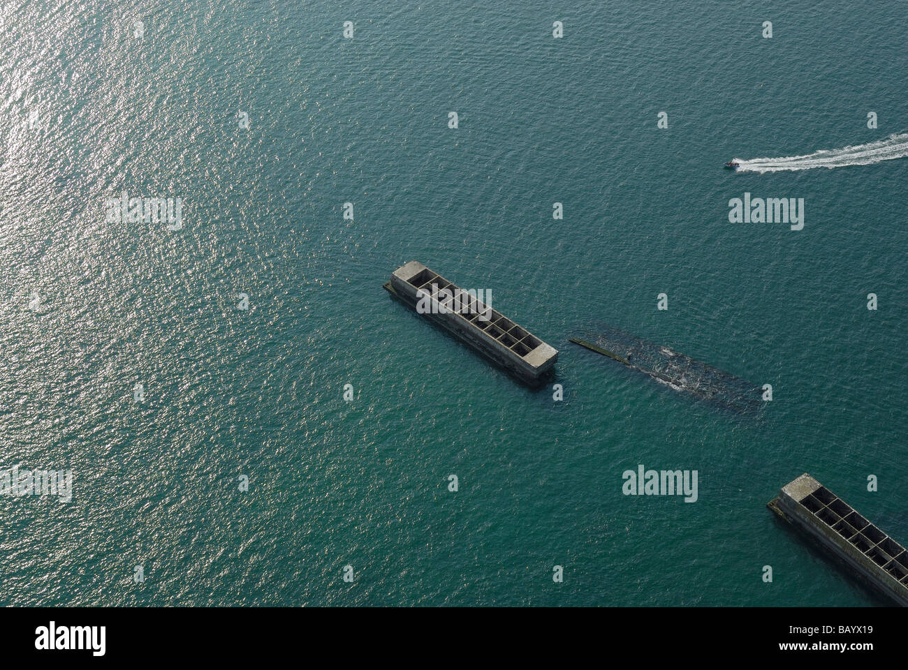 Remains of the artificial harbour Mulberry B in Arromanches Stock Photo ...