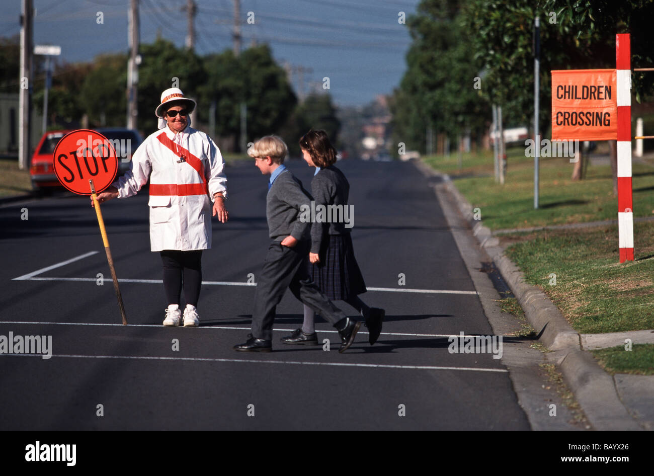 Crossing guard and students, Australia Stock Photo - Alamy