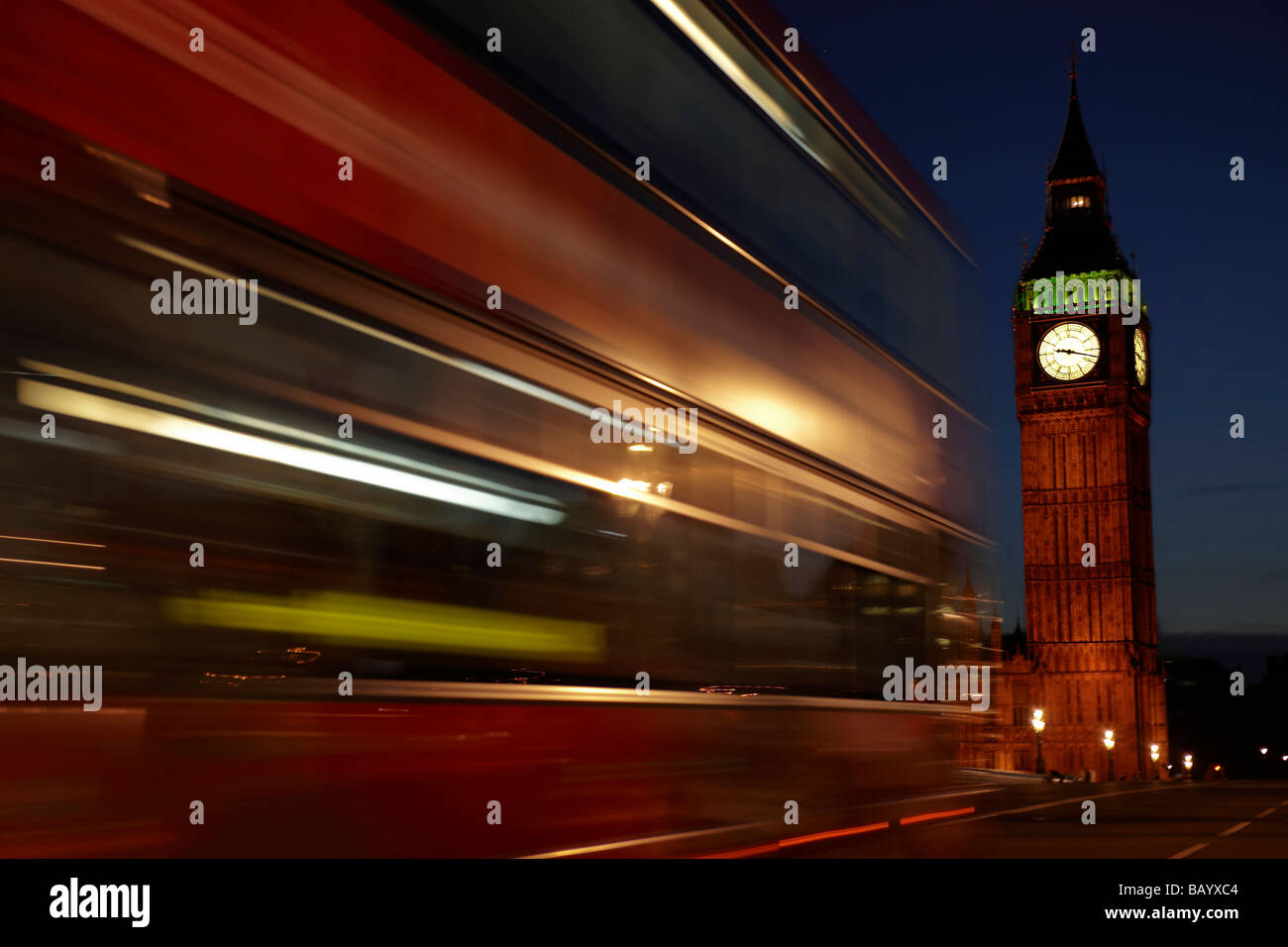 London red double decker bus passing Big Ben at night Stock Photo - Alamy