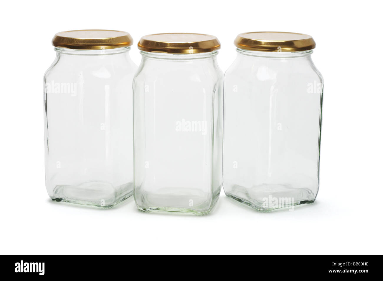 Three empty glass containers on white background Stock Photo - Alamy
