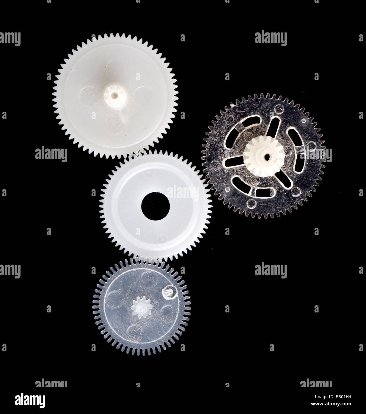 set of gears isolated on black background Stock Photo - Alamy