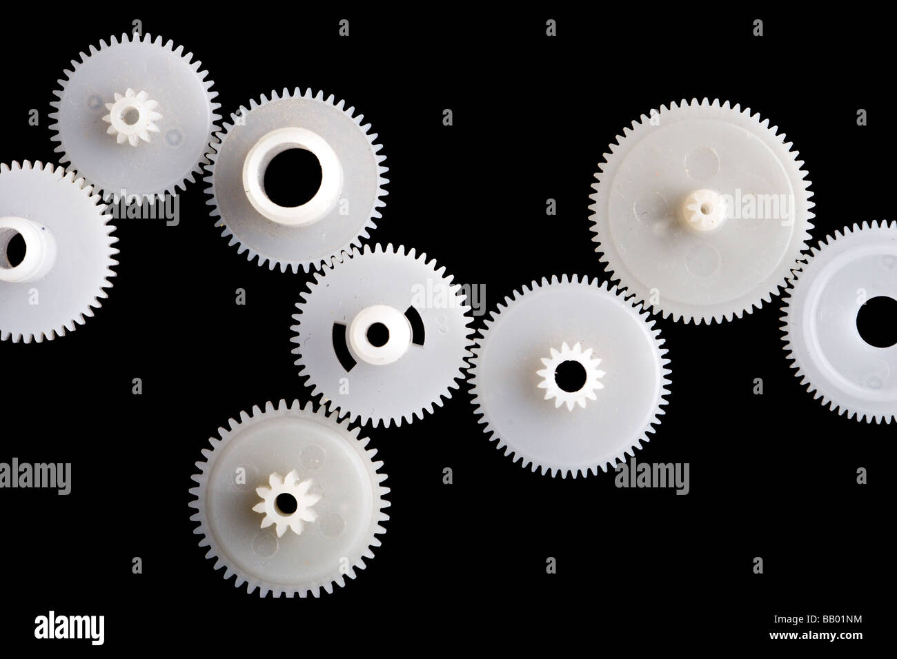 set of gears isolated on black background Stock Photo - Alamy