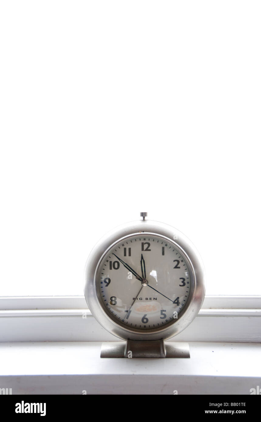 clock on windowsill Stock Photo - Alamy