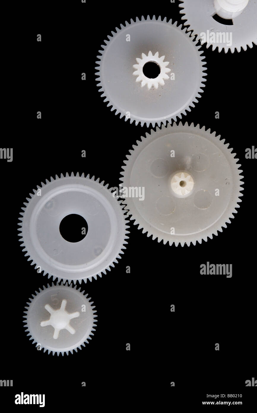 set of gears isolated on black background Stock Photo - Alamy