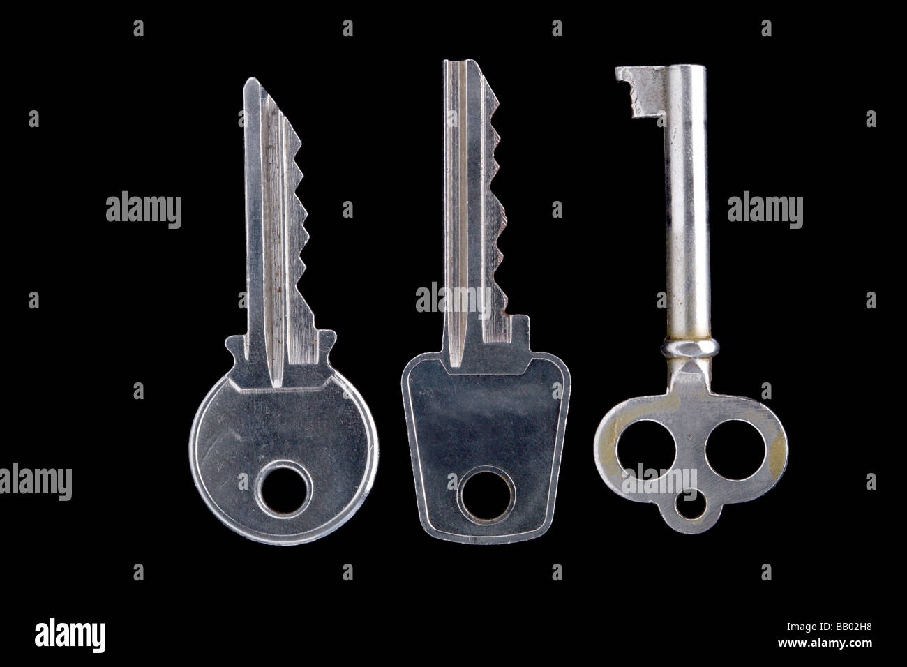 close up of metal keys isolated on black background Stock Photo - Alamy