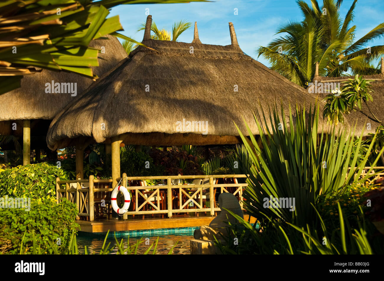 Dining huts with natural architecture between palmtrees at Sugar Beach ...