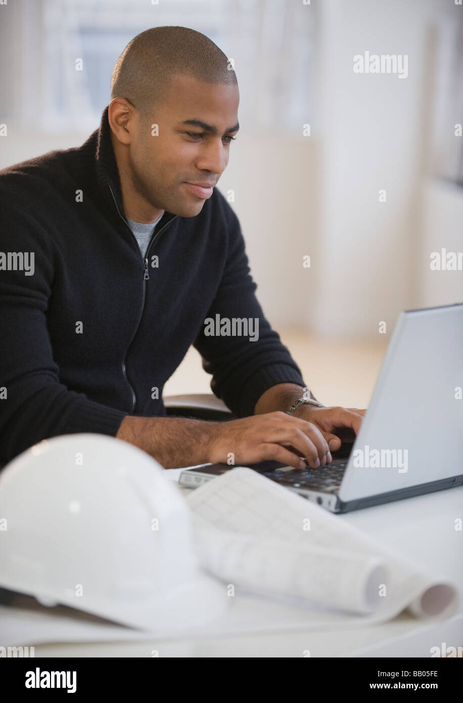 African American architect using laptop Stock Photo - Alamy