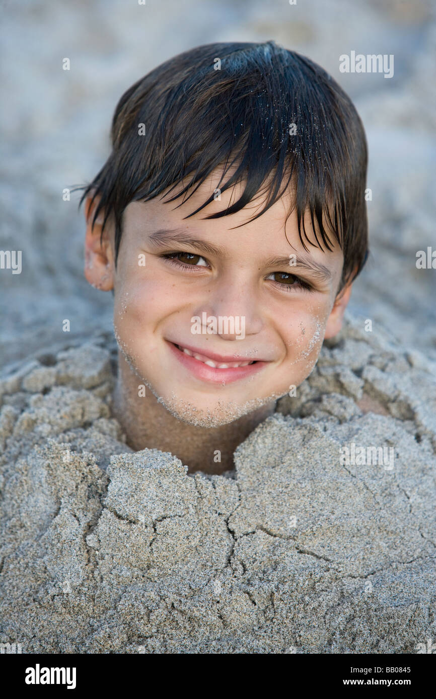 Person buried in sand hi-res stock photography and images - Alamy