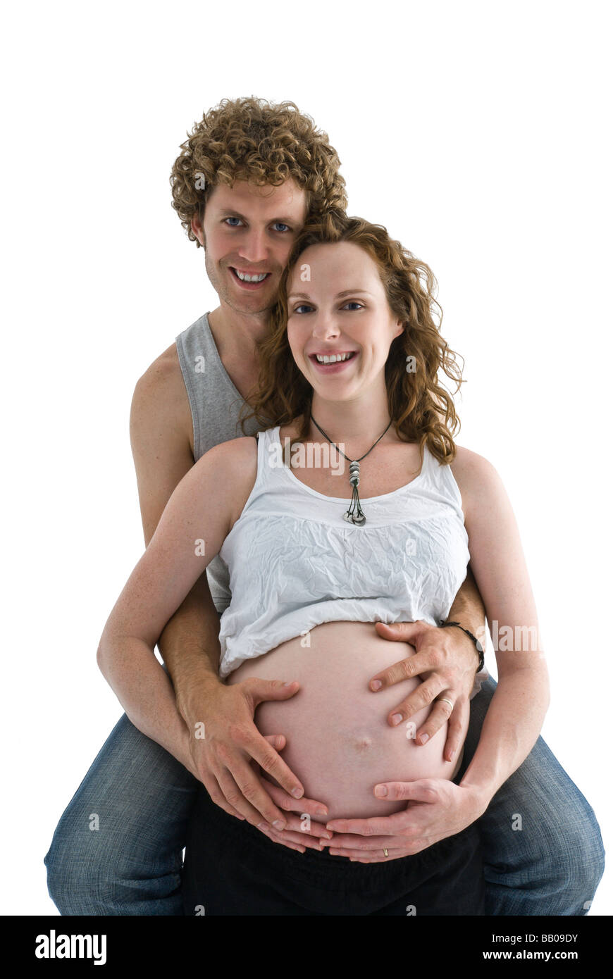 Happy pregnant couple in an embrace Stock Photo - Alamy