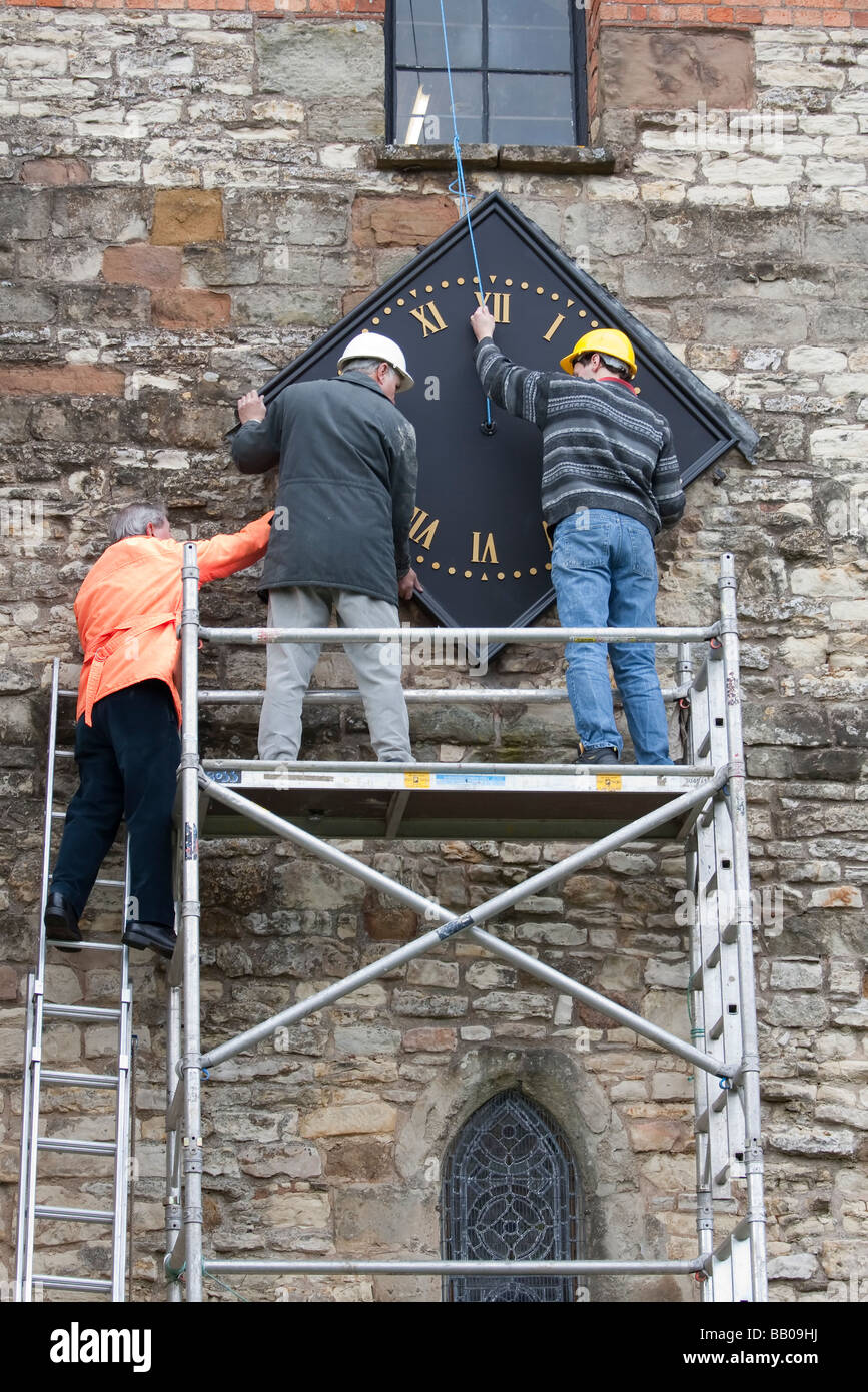 Replacement of a clock face on a church tower, England, UK Stock Photo ...
