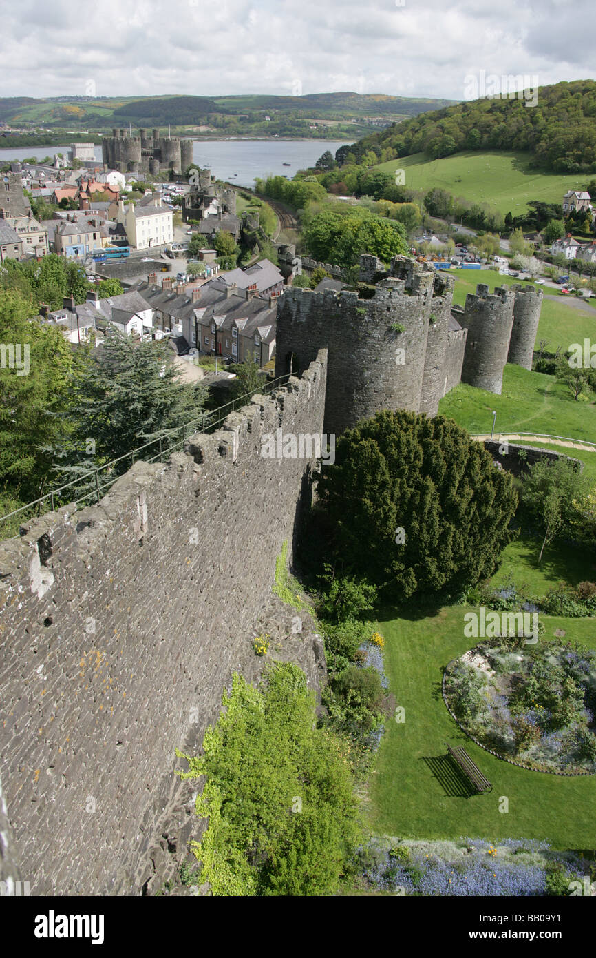 Town of Conwy, Wales. Conwy Town Wall walkway with Conwy Castle and the ...