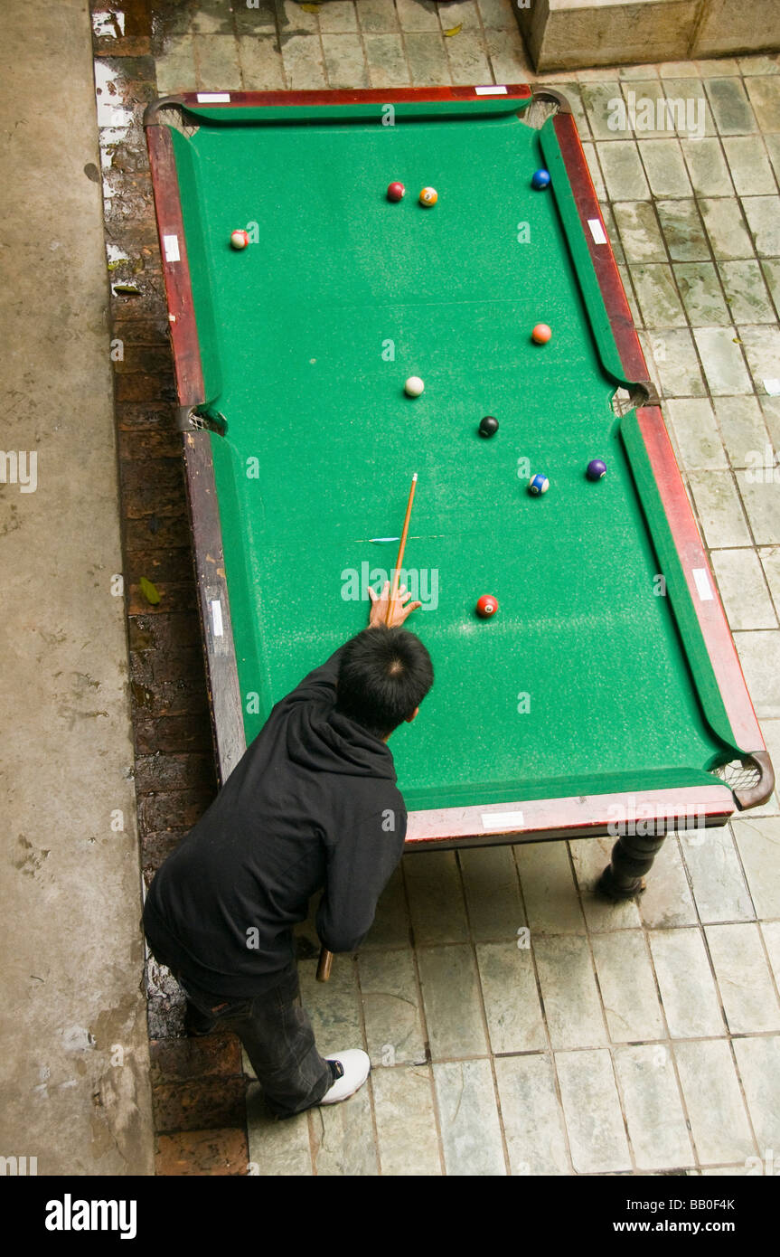 billiard player in action in Kunming China Stock Photo - Alamy