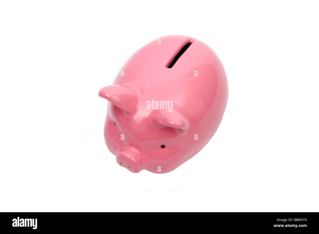 Pink Piggy bank pig against a white background Stock Photo - Alamy